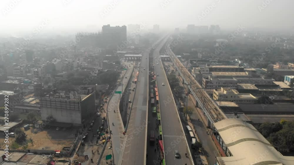 Electric rapid public transport in India, Vehicles moves along delhi ...