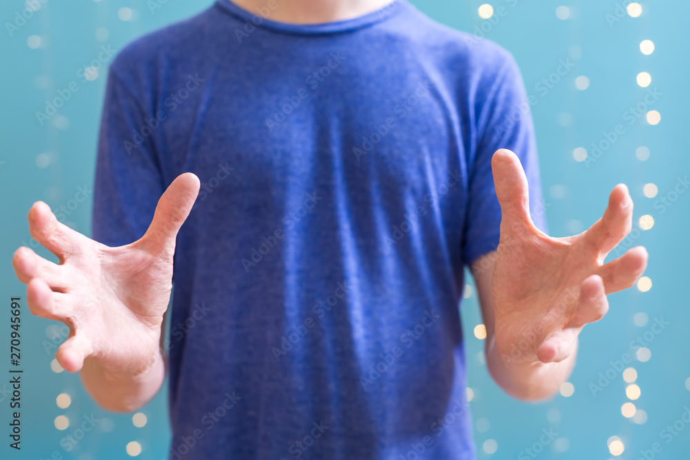 Person making a display gesture on a shiny light blue background Stock ...