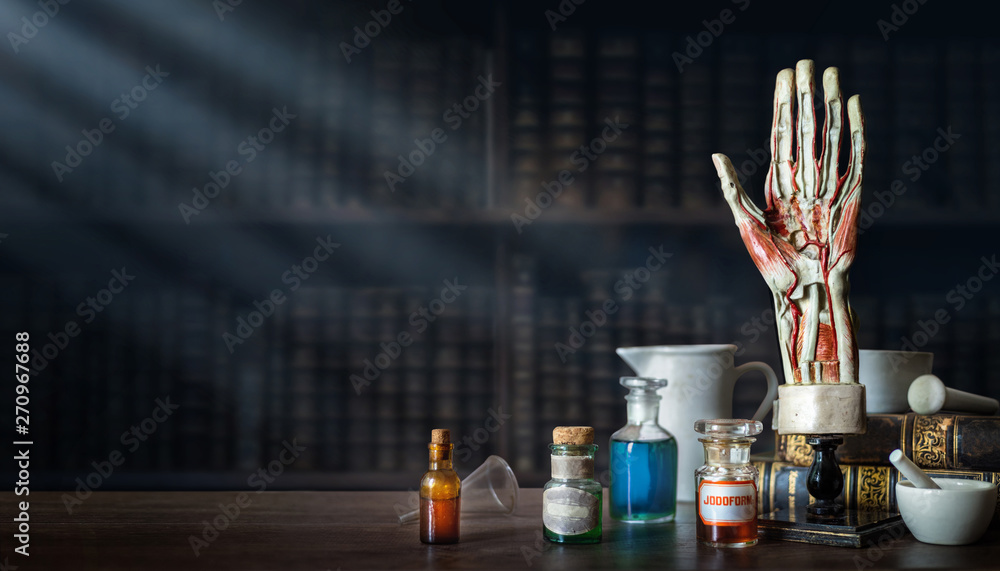 Vintage layout of a man's hand, old medical glass bottles, antique ...