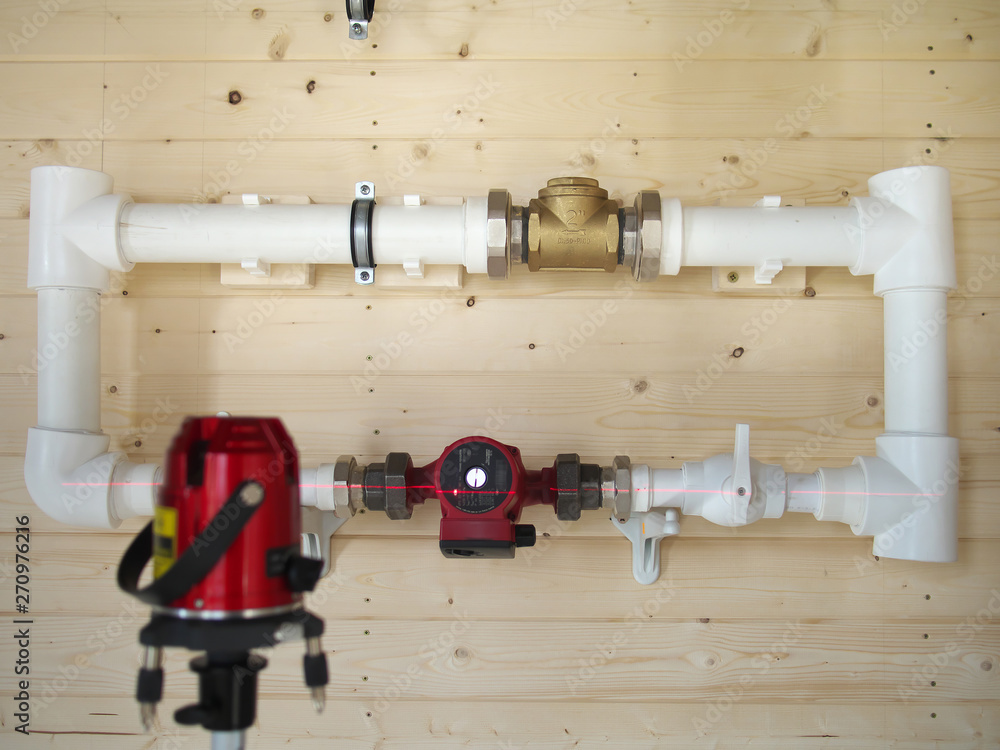 mounting of gravity heating system equipment with laser level in a ...