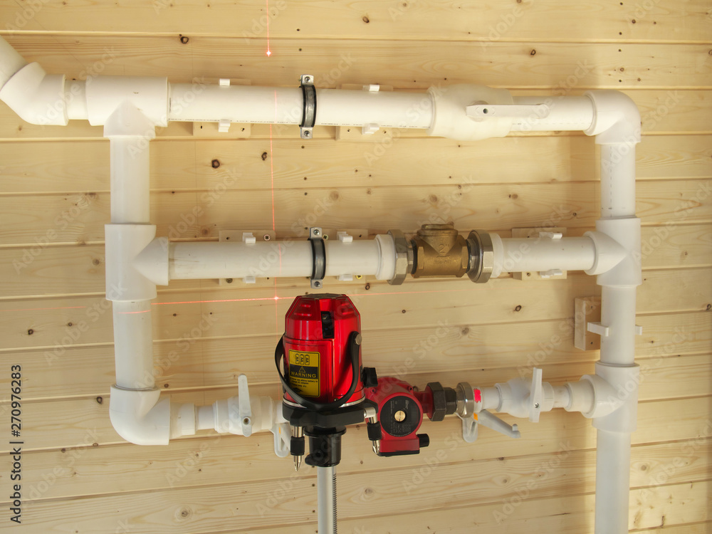 mounting of gravity heating system equipment with laser level in a ...