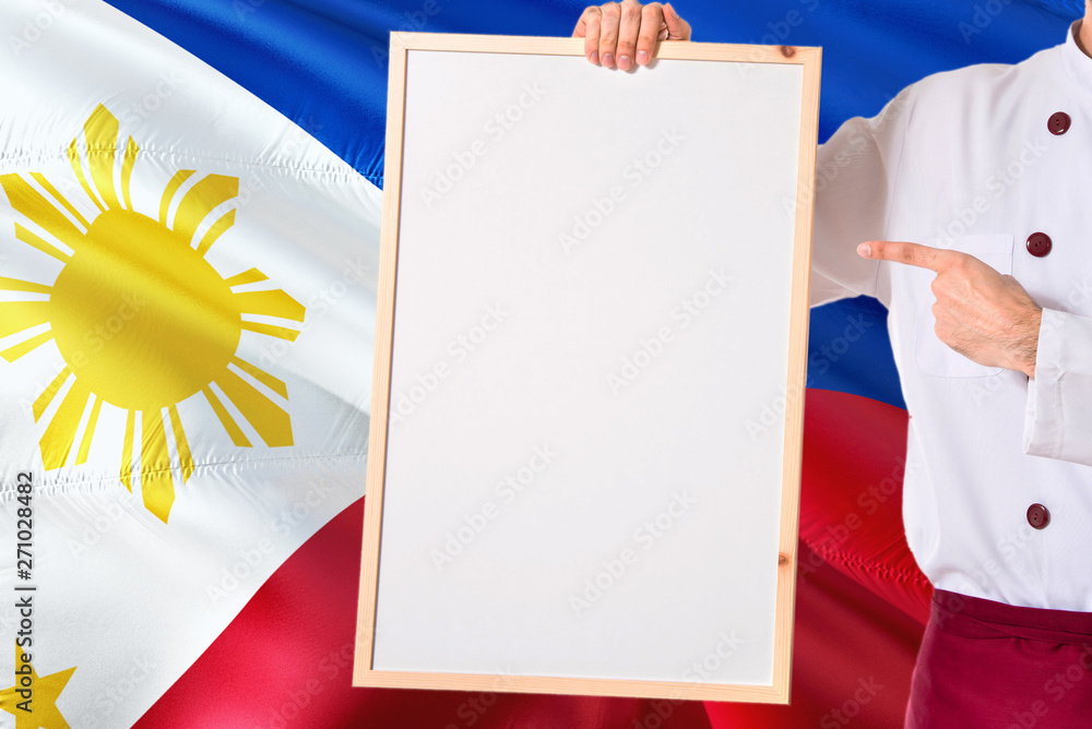 Filipino Chef holding blank whiteboard menu on Philippines flag ...
