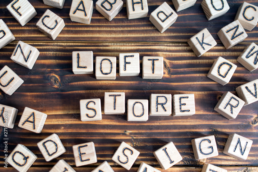 words loft store wooden cubes letters, on a dark wooden burnt ...