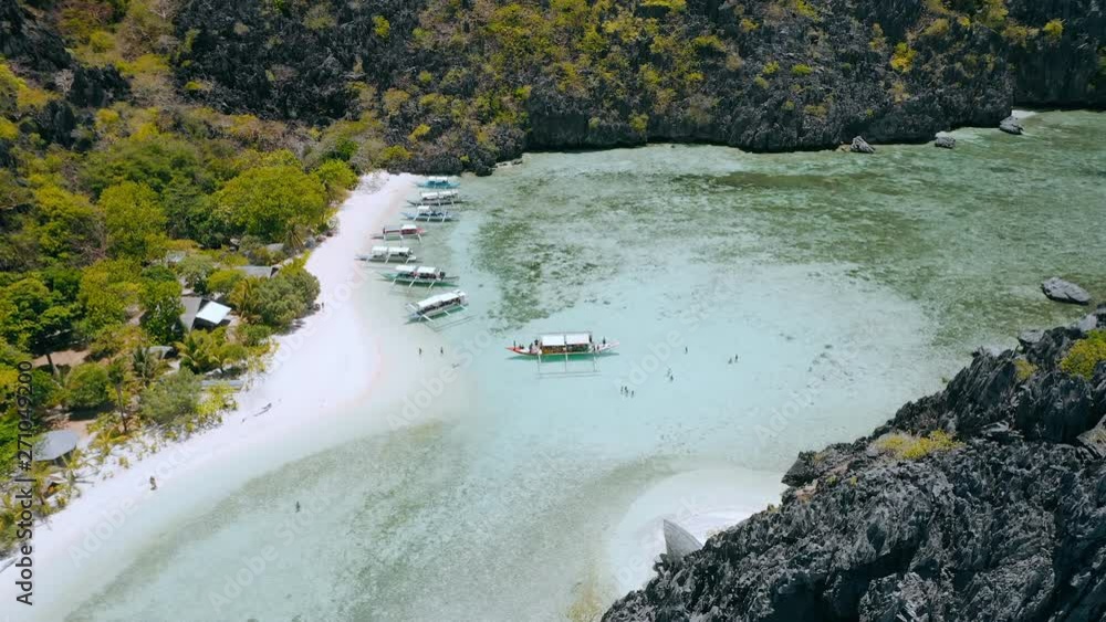 Hidden lagoon of star beach on Tapiutan island near Matinloc shrine. El ...