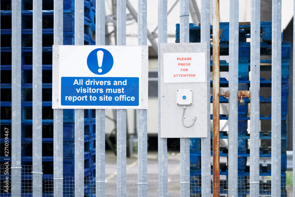 Driver and visitors report to site office sign and entrance buzzer ...