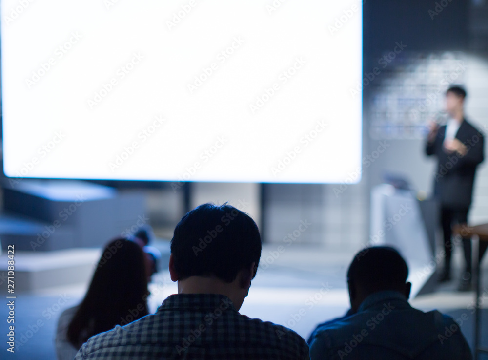 Presenter at corporate conference giving seminar speech. Speaker giving ...