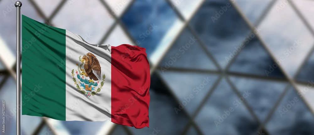 Mexico flag waving in the wind against blurred modern building ...