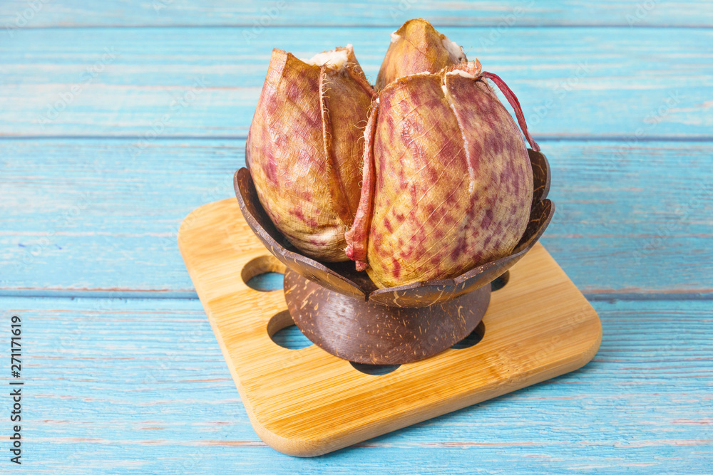 Glutinous rice or Lemang Periuk Kera cooked in pitcher plant leaves ...