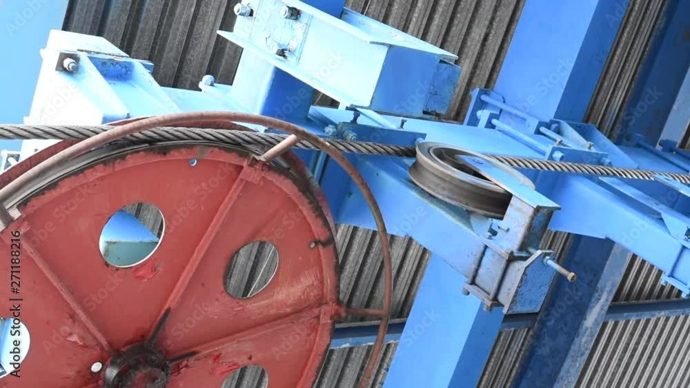 End rail mechanism of the cable car in action in natural light Rotating ...