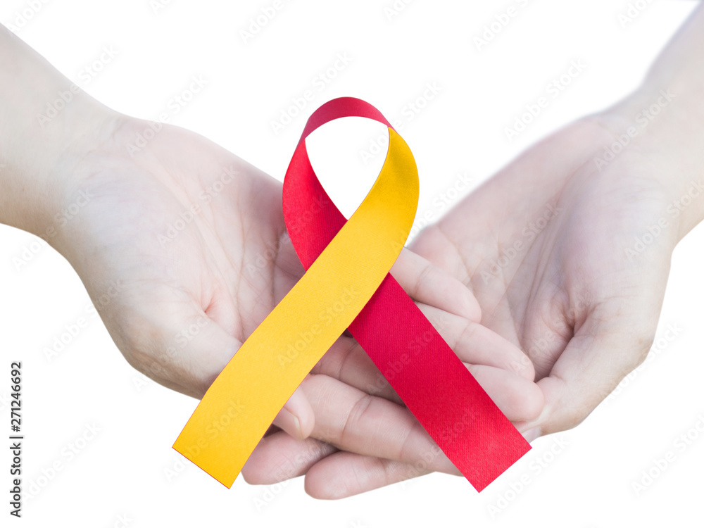 World hepatitis day concept. Red and yellow ribbon awareness on hand ...