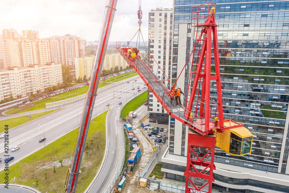 Installing the jib of a construction crane using another crane on the ...