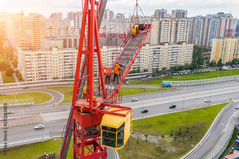 Installing the jib of a construction crane using another crane on the ...