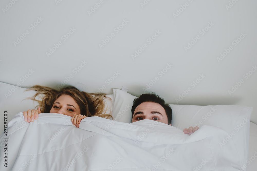 loving couple sleeping in bed.happy couple lying together in bed.women ...