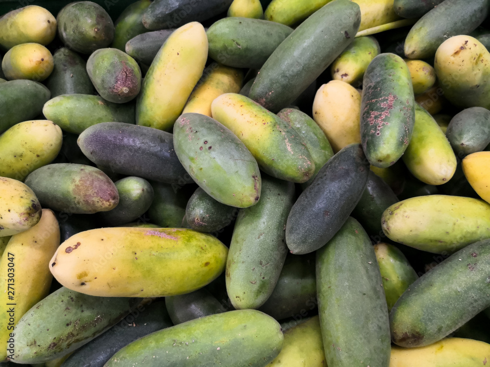 Heap of curuba exotic tropical fruits in a supermarket. Also called ...