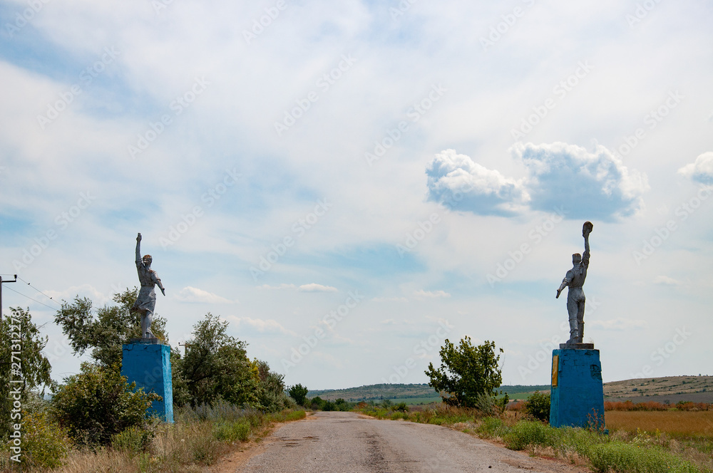 Silhouettes of Worker and Kolkhoz Woman style statues by roadsides ...