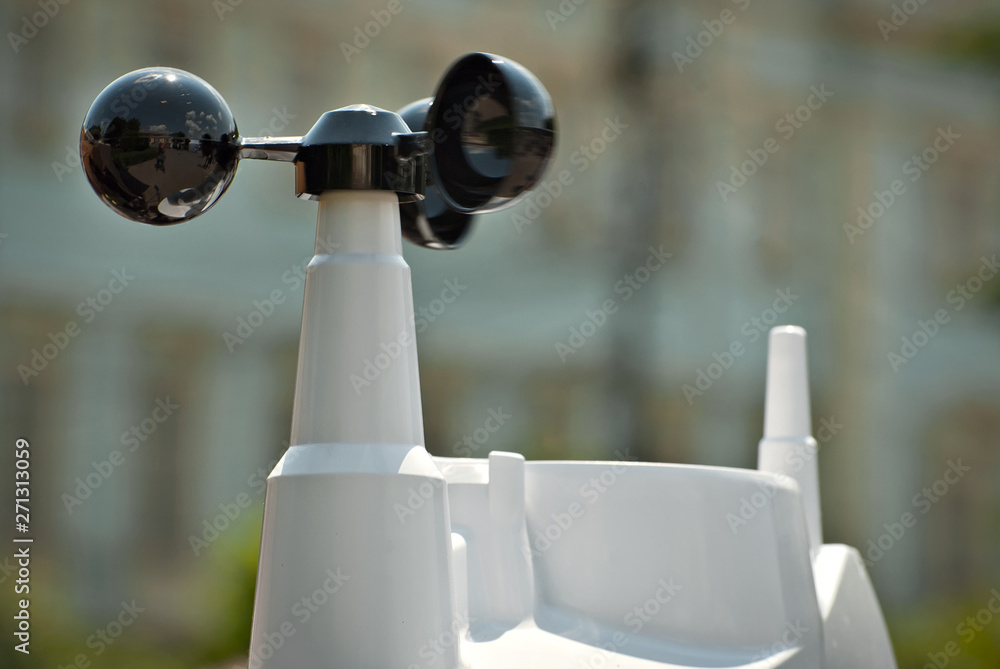 A device that measures speed, force and direction of the wind. White ...