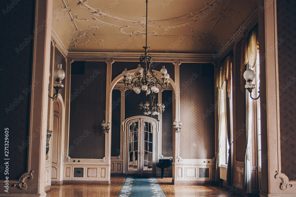 hall of a luxury home. corridor between rooms in an antique mansion ...