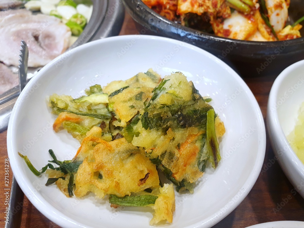 Korean food style, Top view of pancake with egg and scallions on white ...
