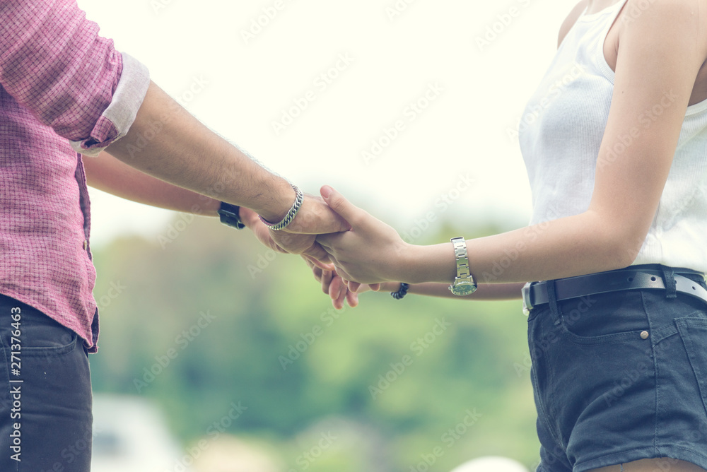 Young couple in love holding hands together with sweet time moment ...