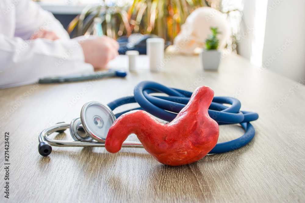 Concept photo of diagnosis and treatment of stomach. In foreground is ...