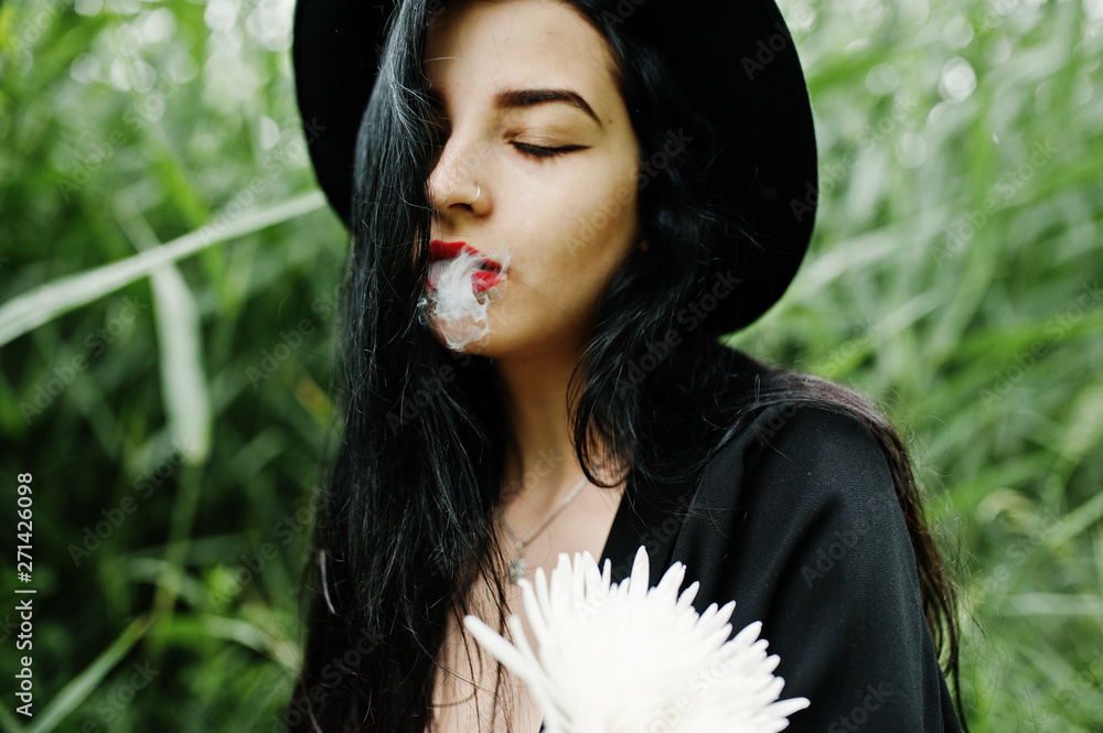 Sensual smoker girl all in black, red lips and hat. Goth dramatic woman ...