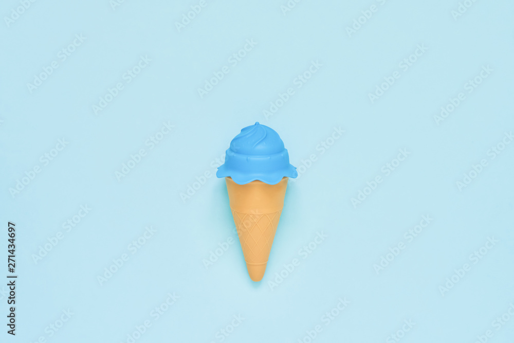 Blue toy ice-cream on lighn blue background. Minimalism, summer concept ...