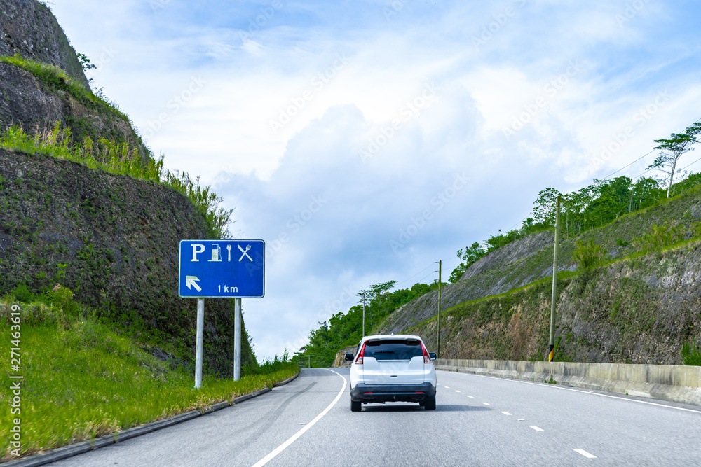 Blue rest stop street sign/signage symbols on dual carriageway highway ...