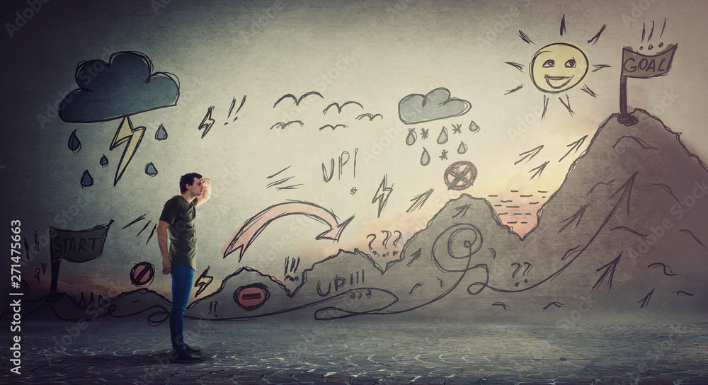 Confident guy starting a life quest with obstacles drawn on wall. Self ...