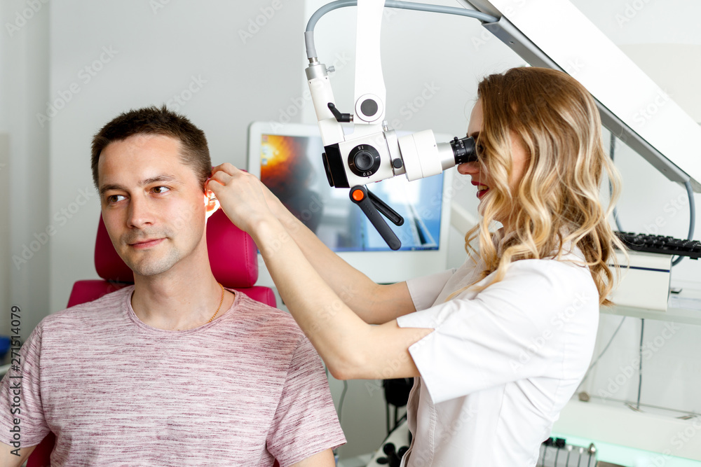Doctor checking patient ear during medical examination, close-up Stock ...