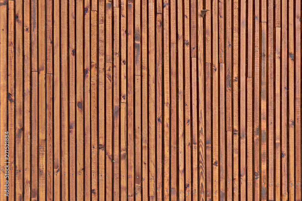 Smooth dark brown boards with knots. Background of wood slats. The ...