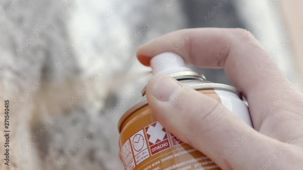 Close-up of artist draws street art spraying spray paint. Action ...