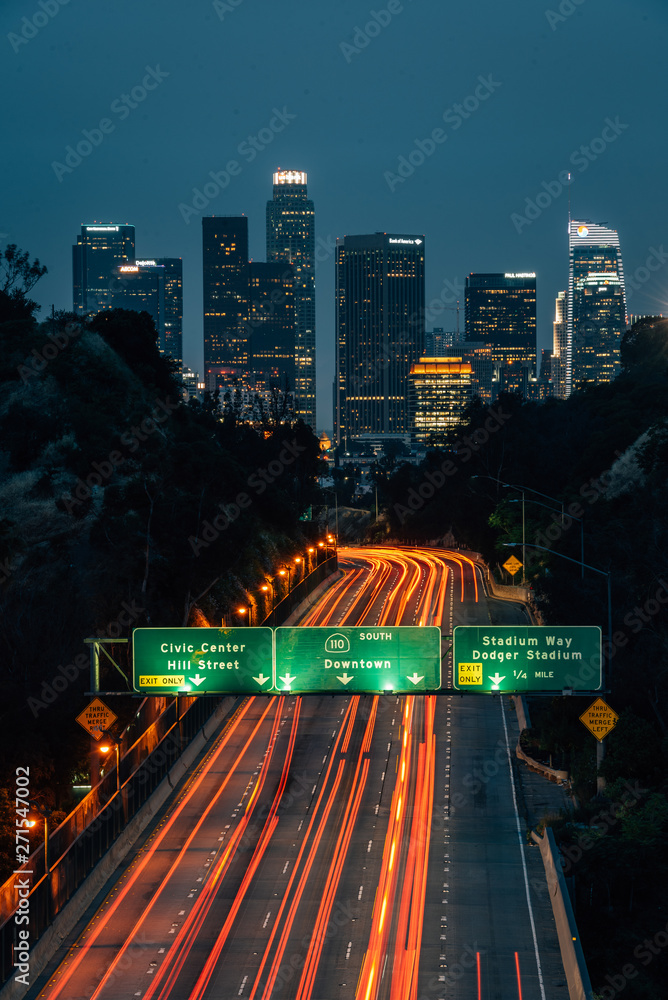View of the downtown Los Angeles skyline and 110 Freeway at night, from ...