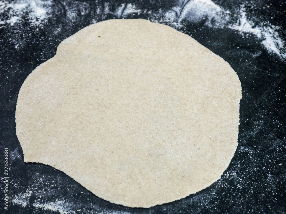 Cooking Indian Chapati bread in the pan in Kochi, Kerala Stock Photo ...