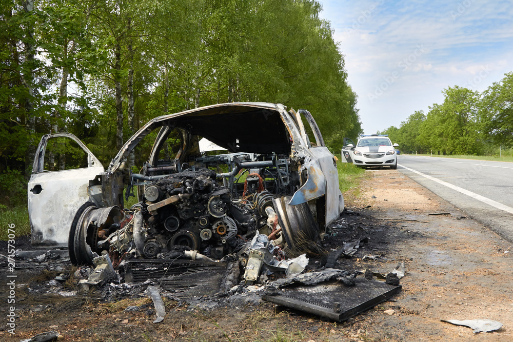 Fully burned car on roadside after collision with heavy truck Stock ...