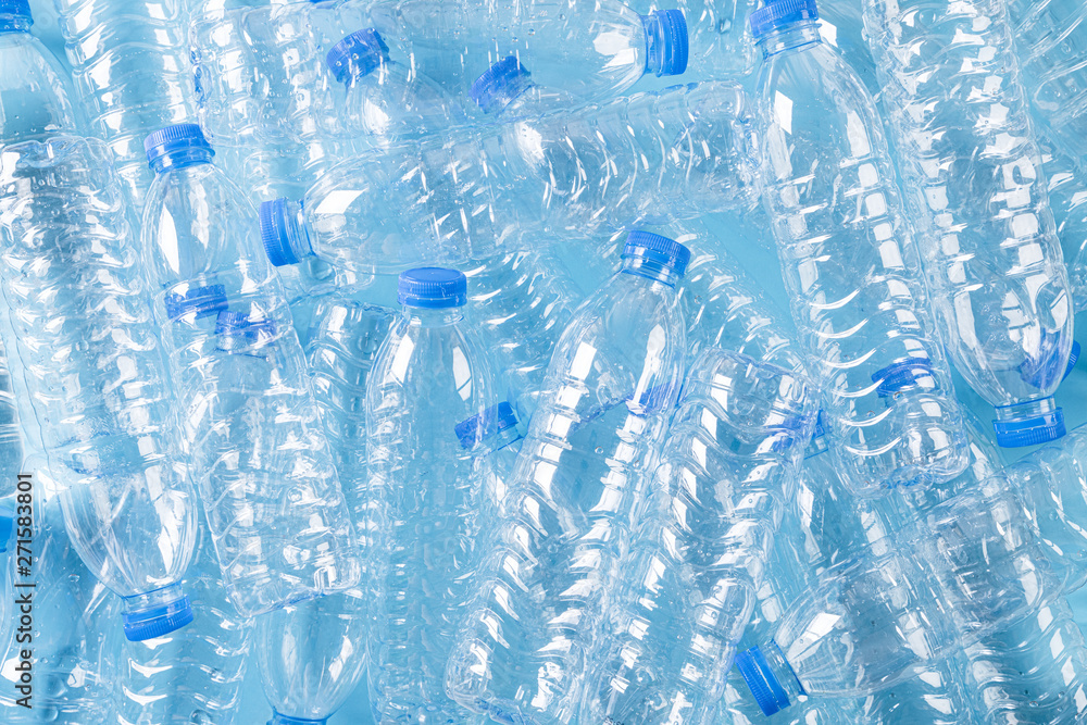 Top view of blue plastic bottles background. Recycle and World ...