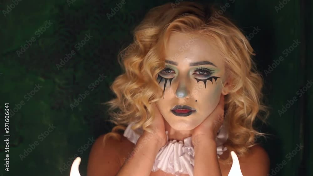 Scary creepy girl with a green face in the Studio for Halloween, she ...