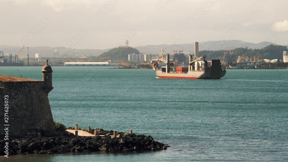 A cargo container ship coming into the port of San Juan, Puerto Rico ...