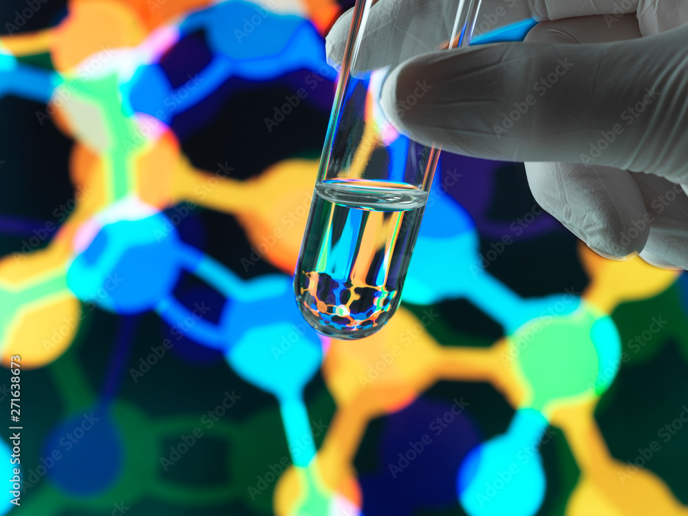 Biotechnology research, Test tube containing a chemical formula with a ...