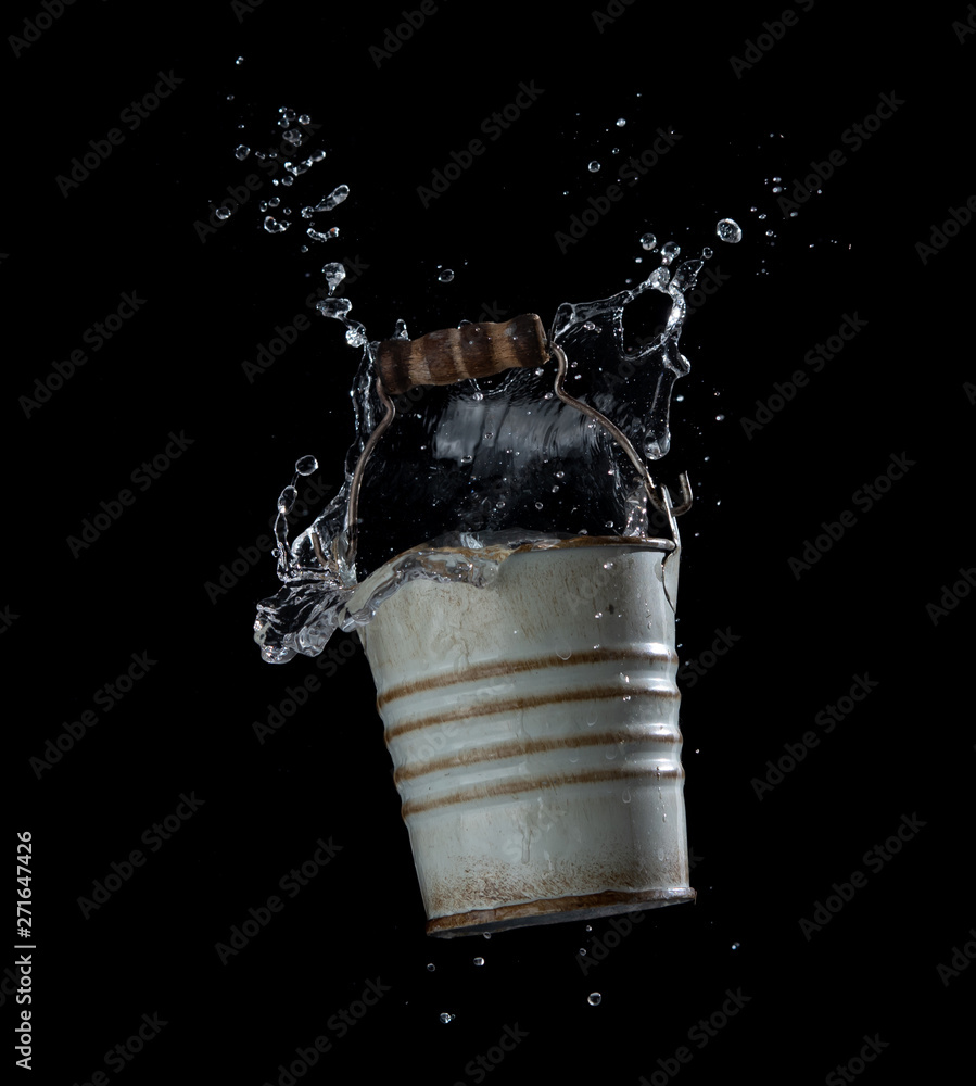 Metal bucket with water splash or explosion flying in the air isolated ...