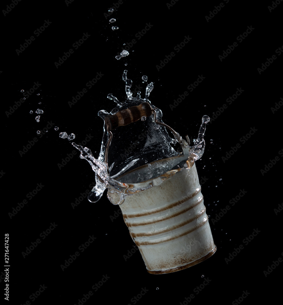 Metal bucket with water splash or explosion flying in the air isolated ...