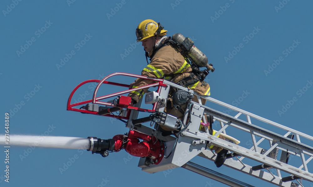 Ladder Pipe Master Stream in Use at a multiple dwelling Stock Photo ...