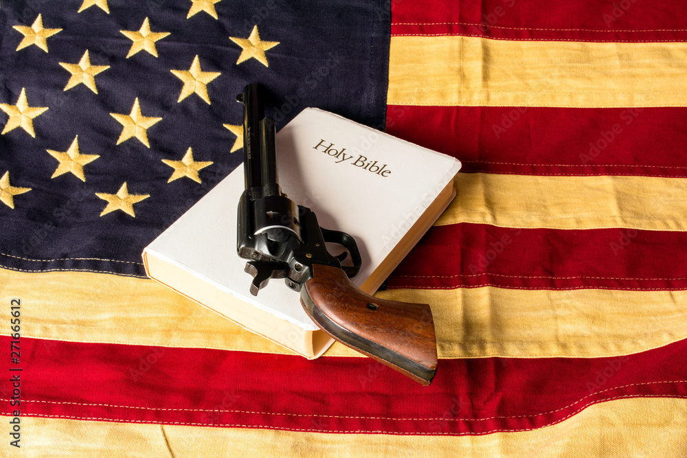 hand gun and white bible on old looking tea stain american flag Stock ...