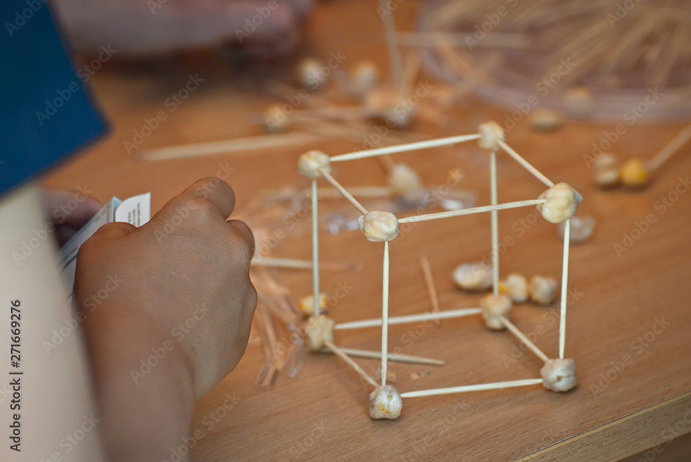The atom model is made of supportive materials. Molecular grid of ...