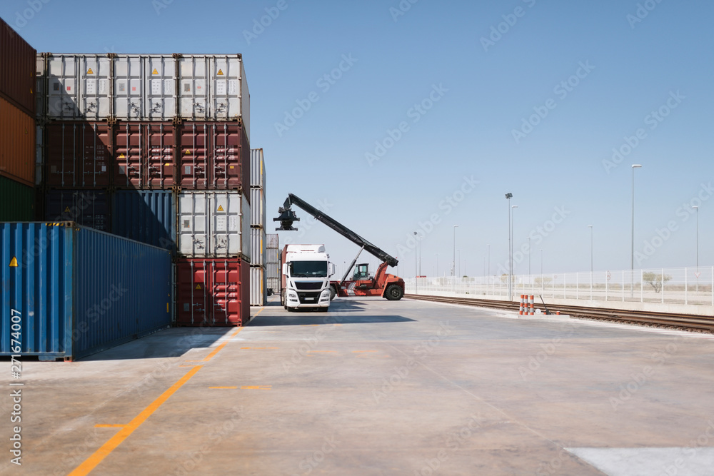Crane lifting cargo container on truck on industrial site Stock Photo ...