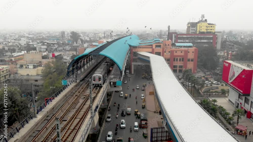 Electric rapid public transport in Delhi, India, Vehicles moves along ...