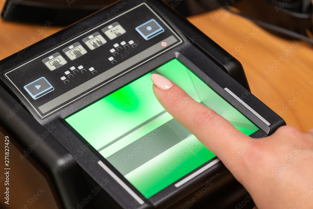 The process of scanning fingerprints during the check at border ...