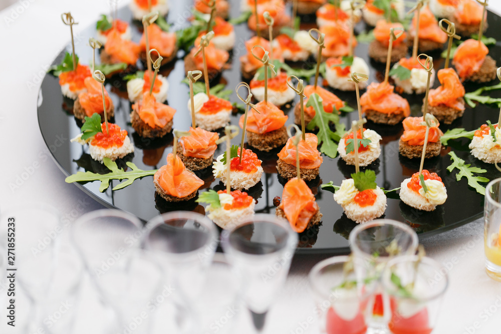 Buffet at the gala dinner. Assortment of canapes. Banquet service ...