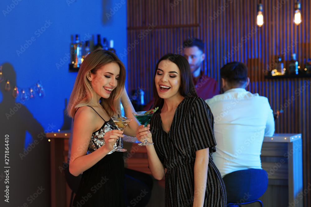 Beautiful young women with martini cocktails in bar Stock Photo | Adobe ...