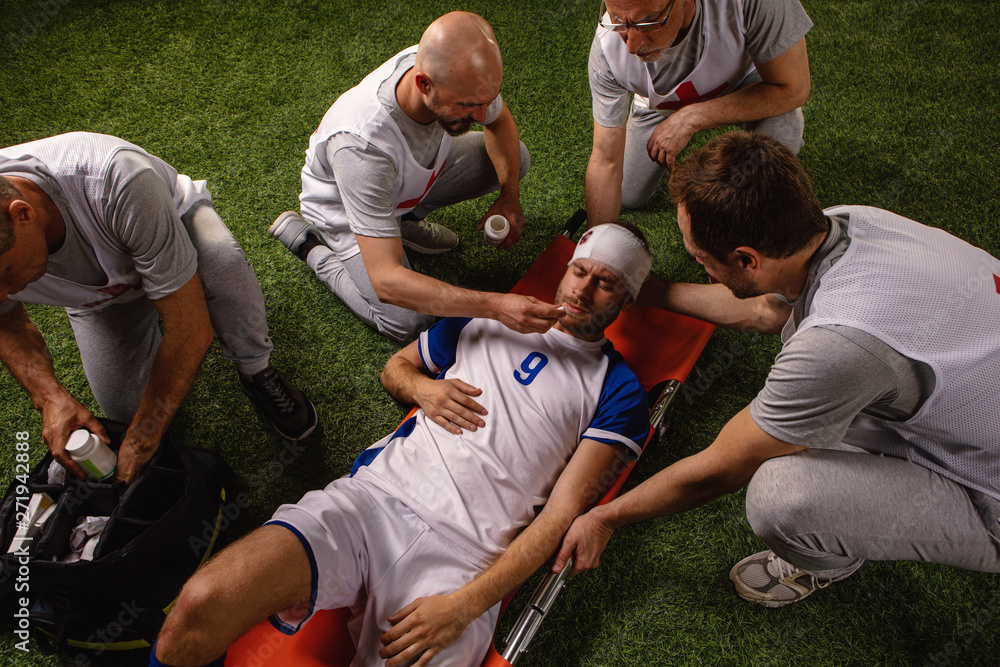 Soccer player received a head injury during the game. Sport Doctors ...