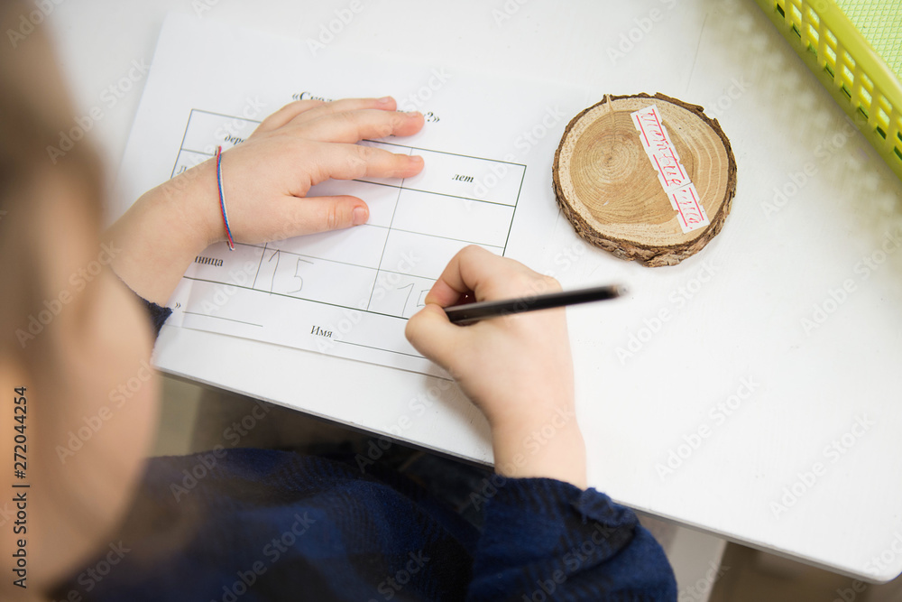 Montessori School. Little girls determine the age of the tree. Tree ...